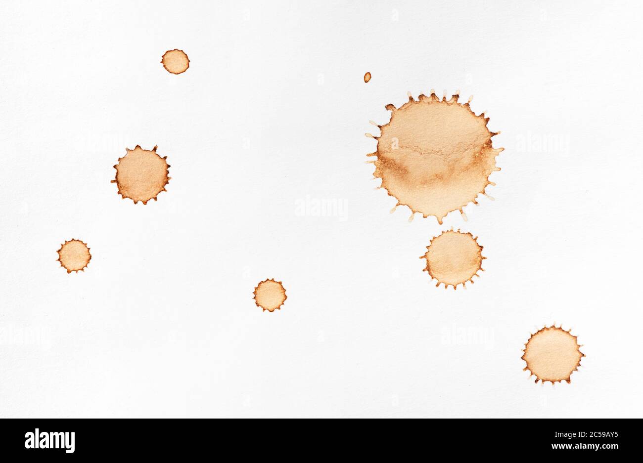 coffee spots on a white background Stock Photo - Alamy