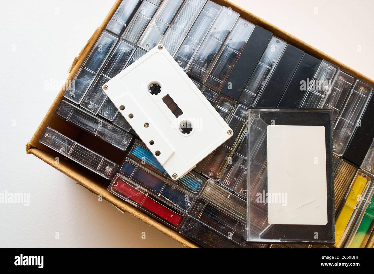 Single white audio cassette without markings on top of the box with ...