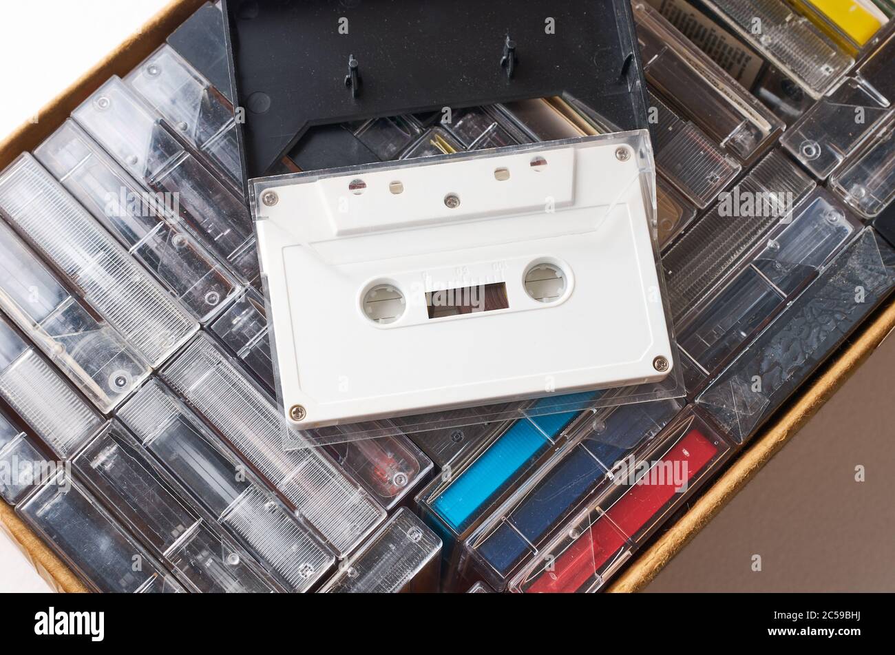 Single white audio cassette without markings on top of the box with ...