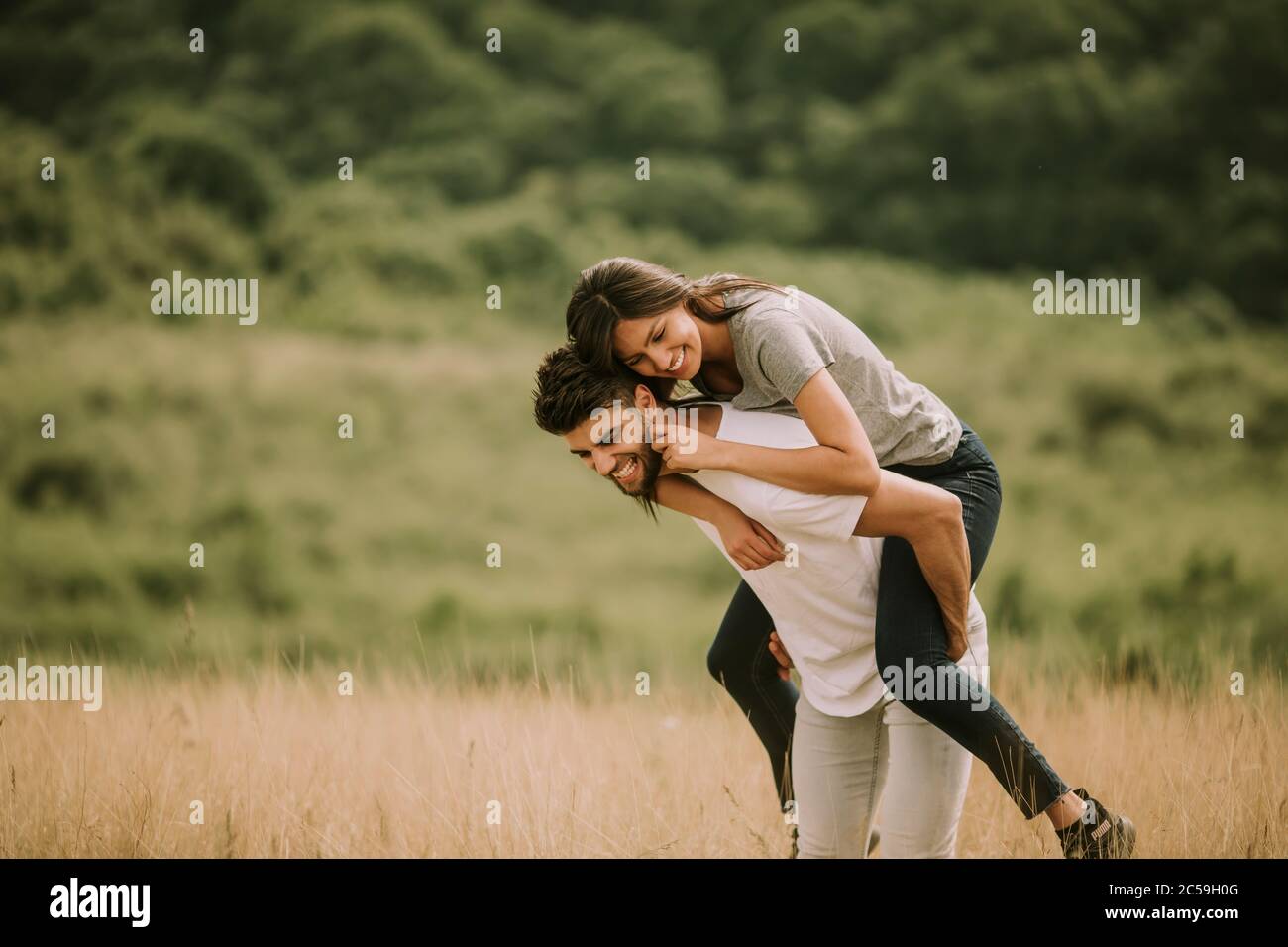 Pretty young couple in love outside in the spring nature Stock Photo ...