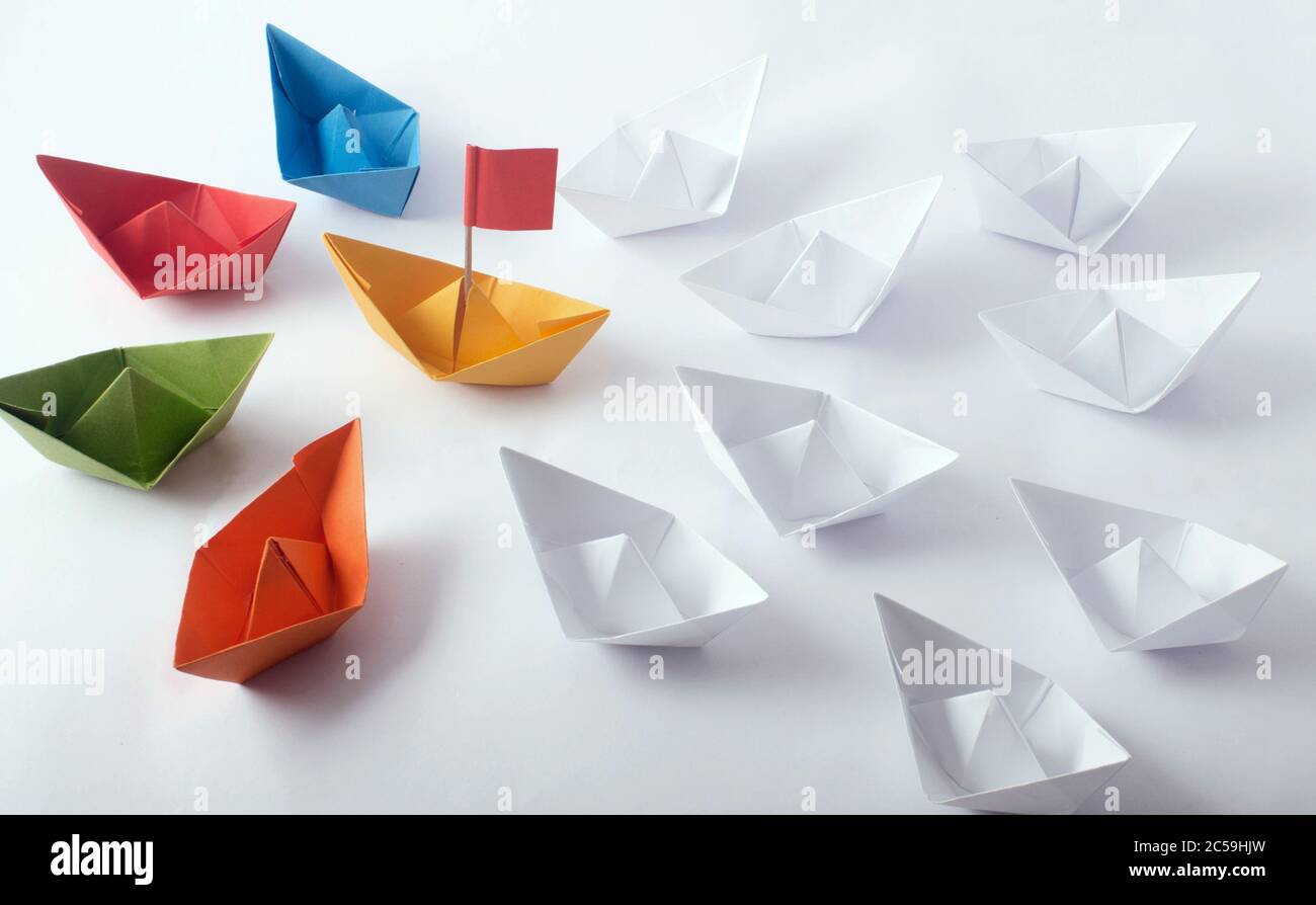 Team Work Concept using different color Origami Paper Boats (ships ...