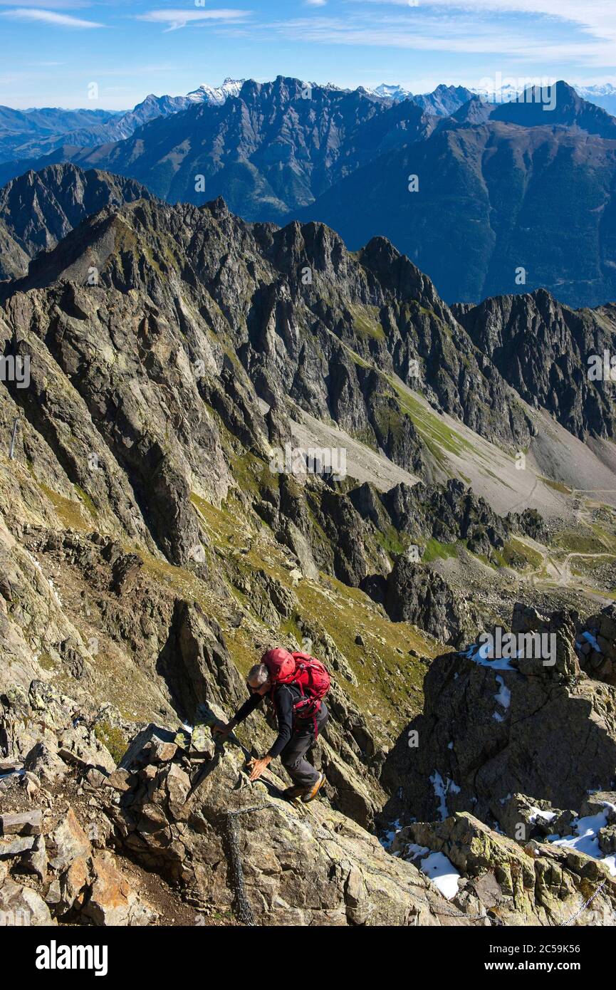 Switzerland, Valais, Trient Valley, les Marécottes, hikers climbing on ...