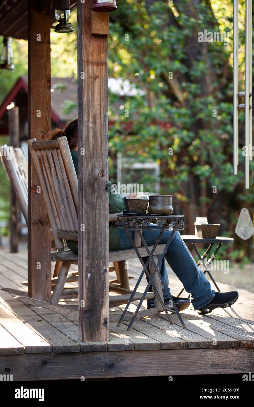 Rocking chair log cabin porch hi-res stock photography and images - Alamy