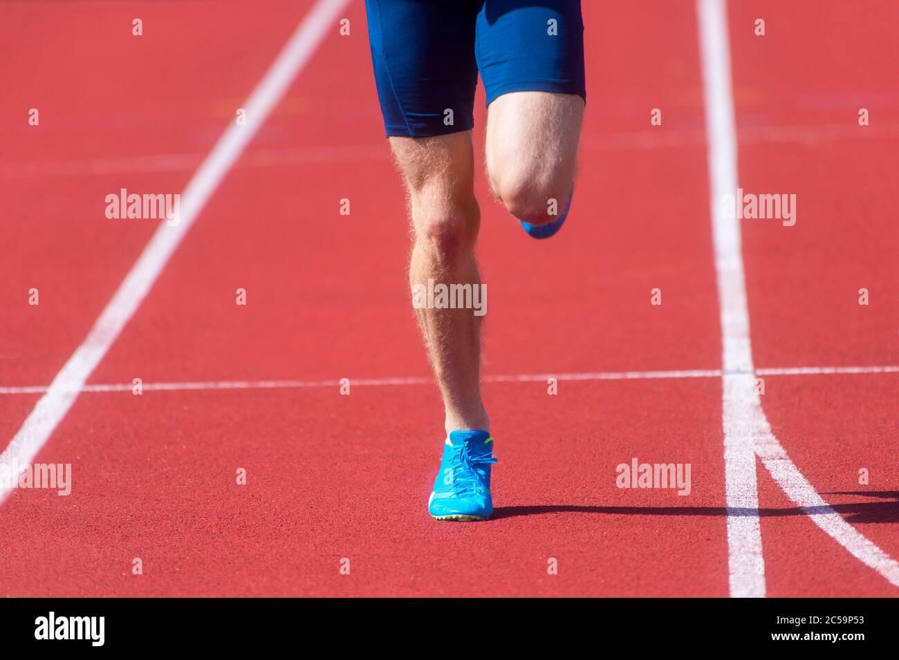 Close up of runners feet on the track field. Sports and healthy ...