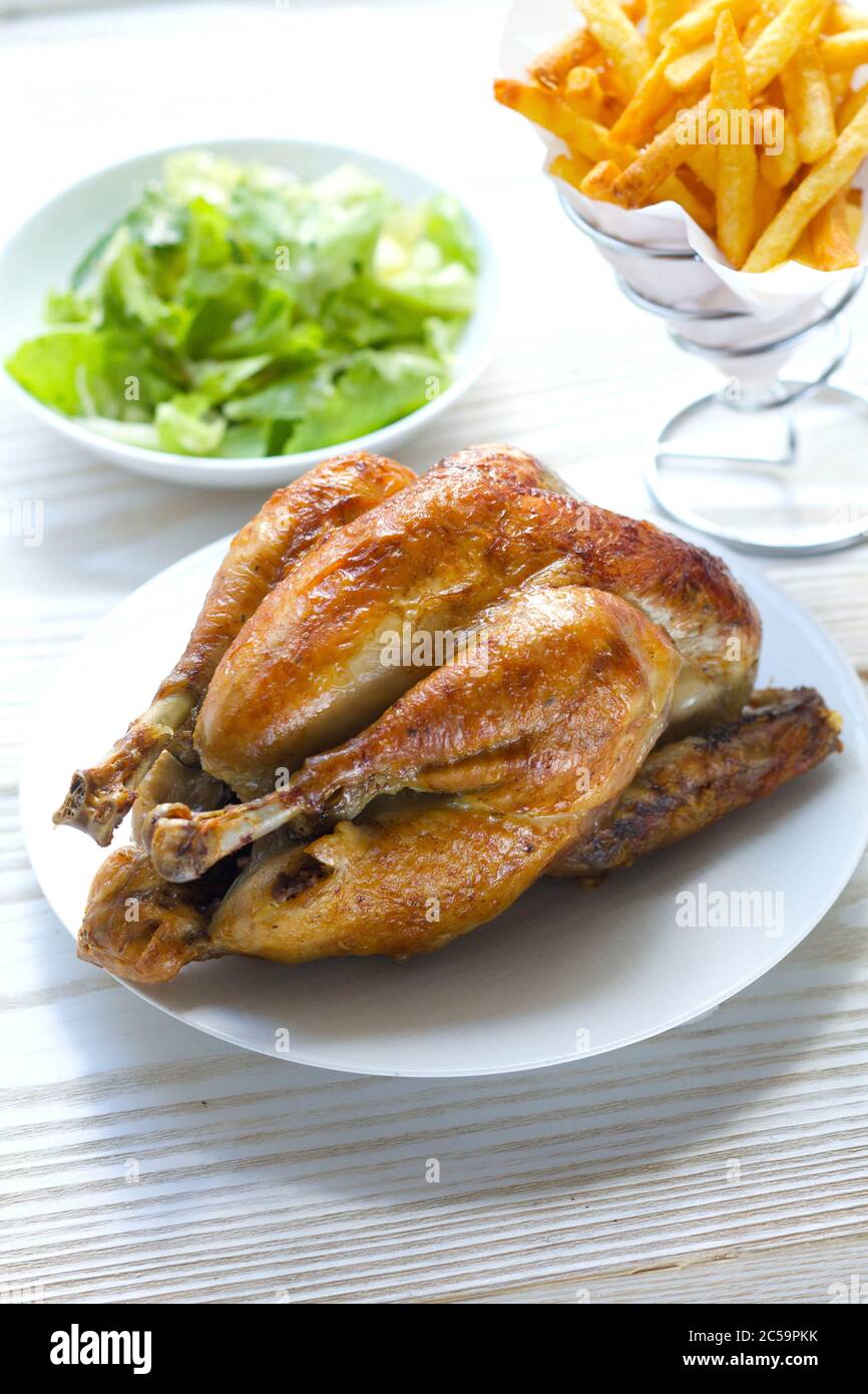 Le coq rico roast chicken pont neuf apple Stock Photo - Alamy
