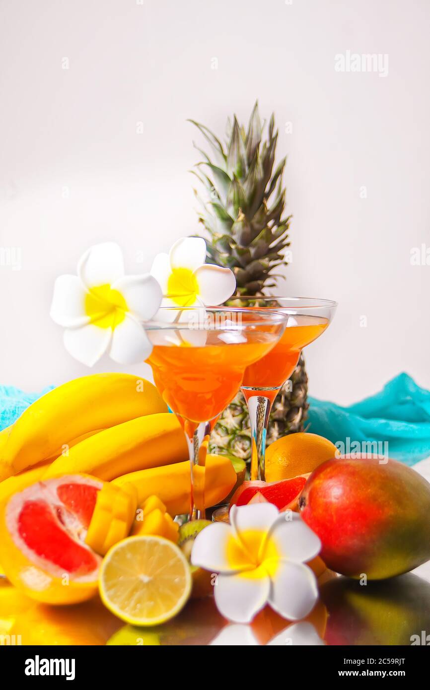 Glasses of tropical exotic multifruit juice cocktails drink with ...