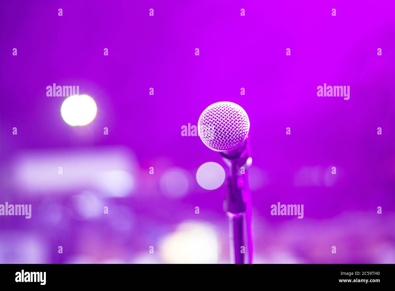 microphone in a stage with a blurred background. Singer live concert ...