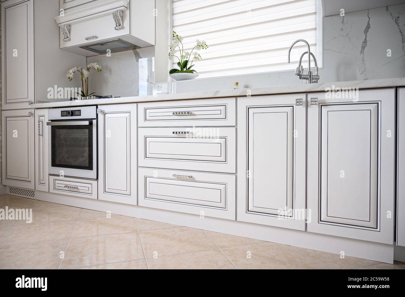 Luxury modern classic white kitchen interior Stock Photo - Alamy