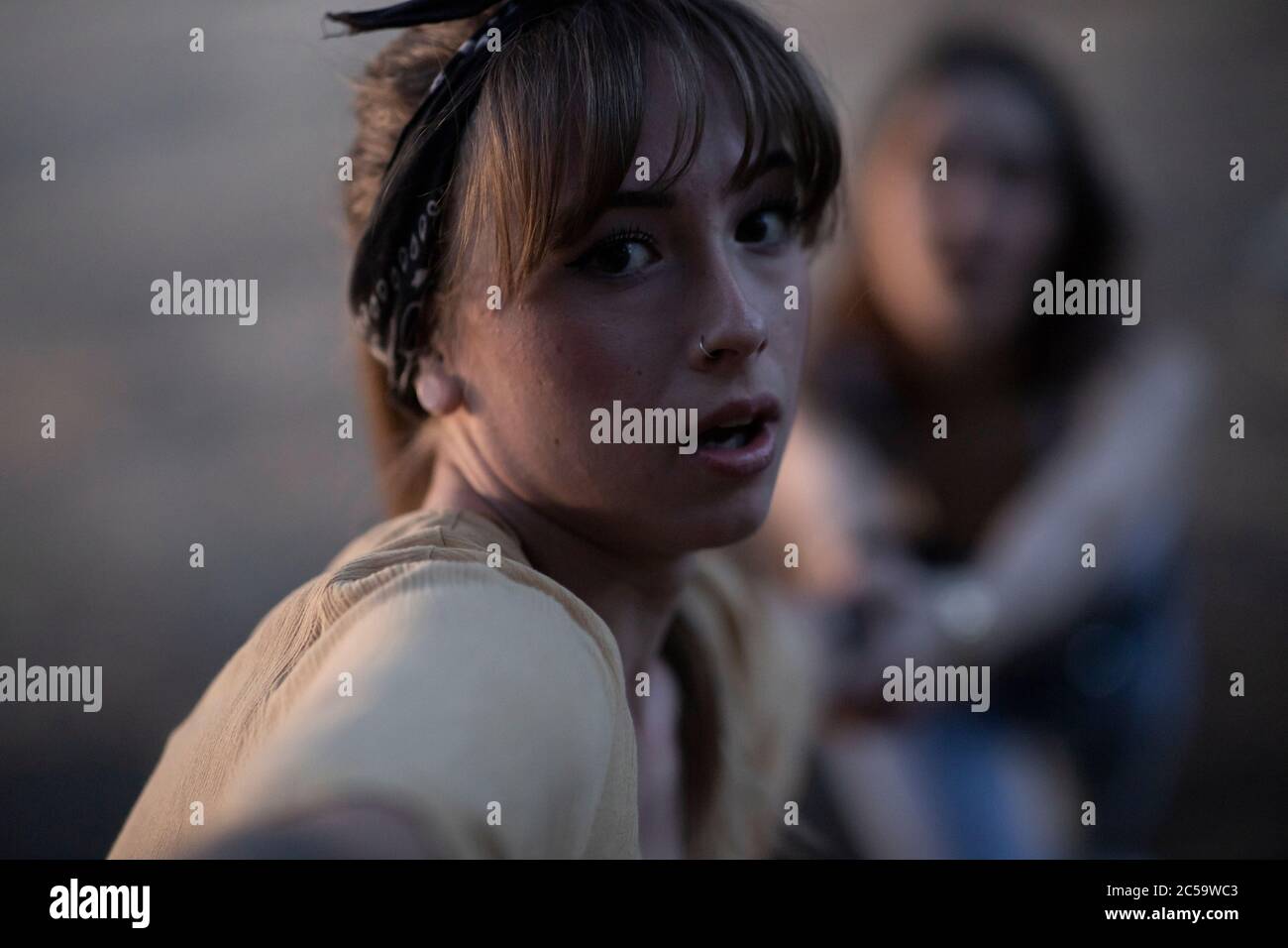 two girls in the forest flee terrified Stock Photo - Alamy