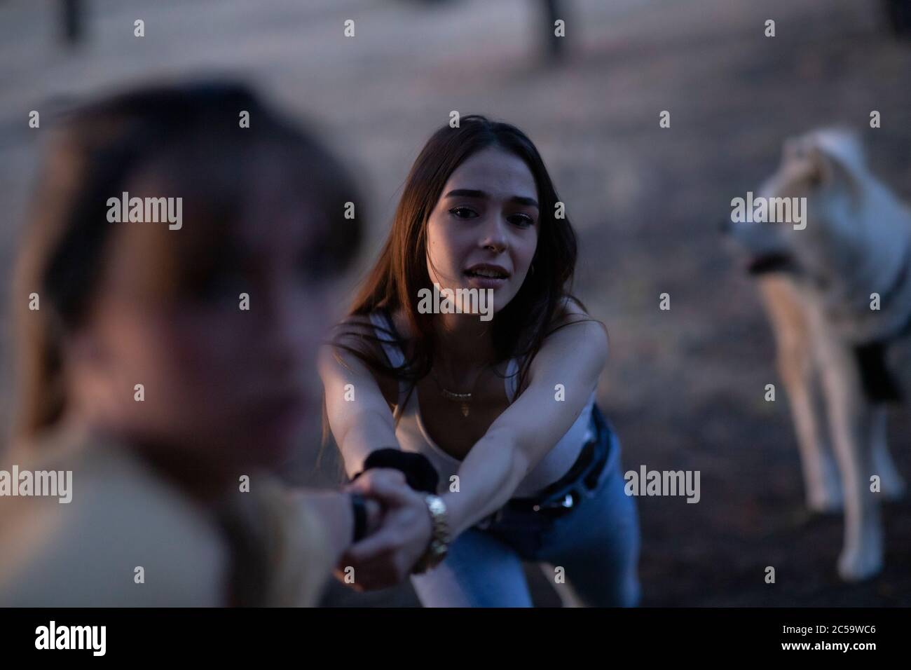 two girls in the forest flee terrified Stock Photo - Alamy