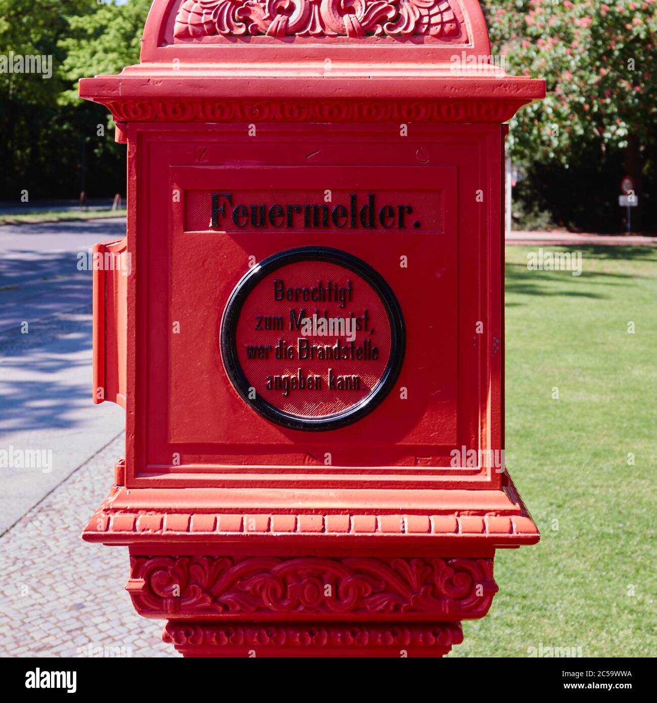a beautiful nostalgic red fire alarm on the street in Germany ...