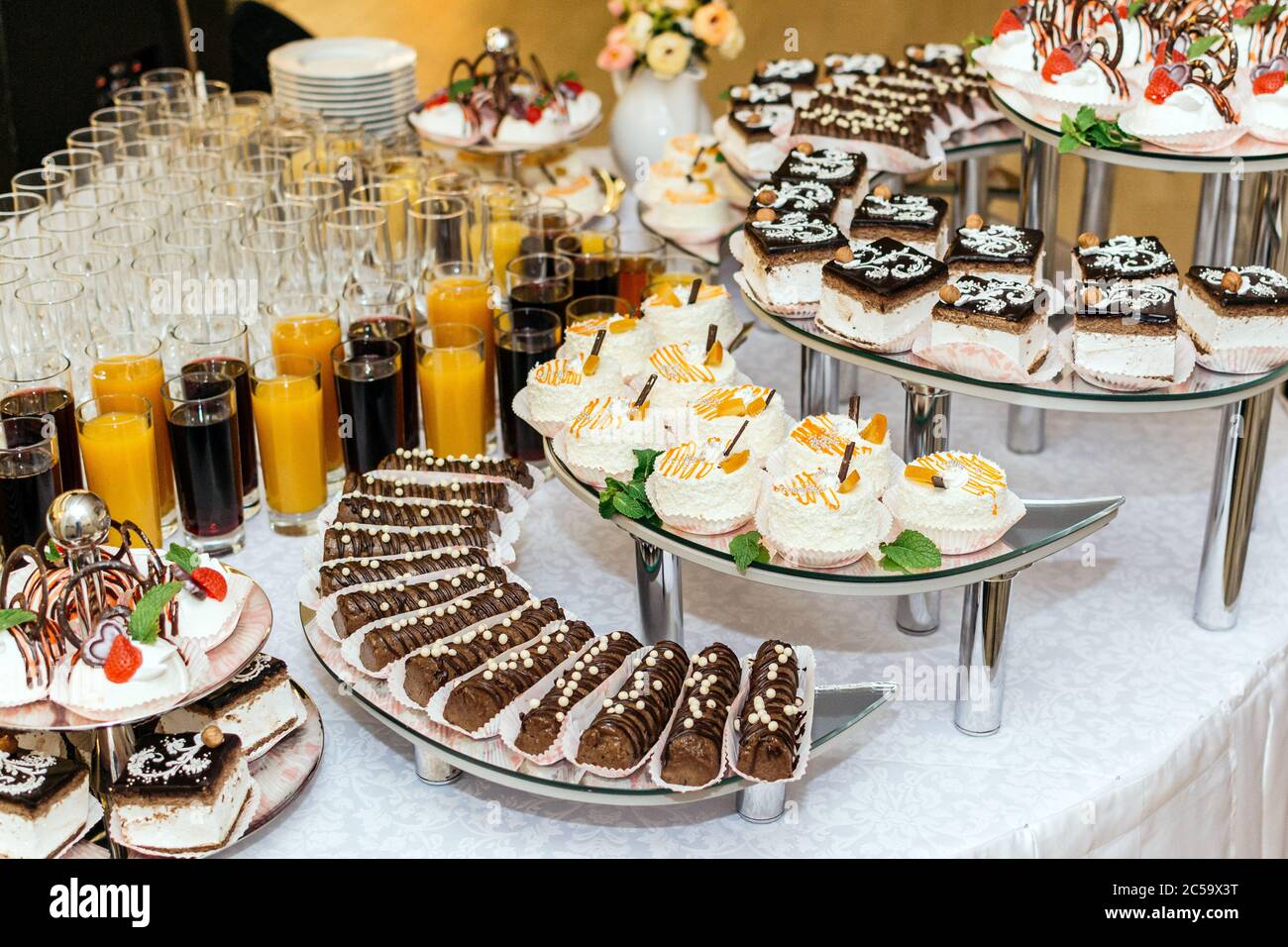 Festive banquet table with cakes and drinks Stock Photo - Alamy