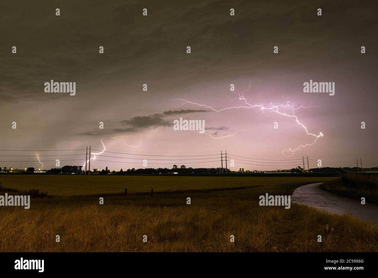 Lightning storm over a wheat field at night Stock Photo - Alamy