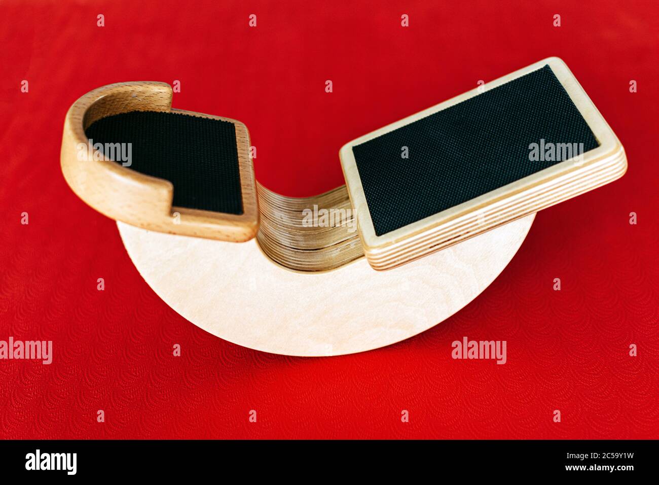 Balanceboard simulator on a red background closeup Stock Photo - Alamy