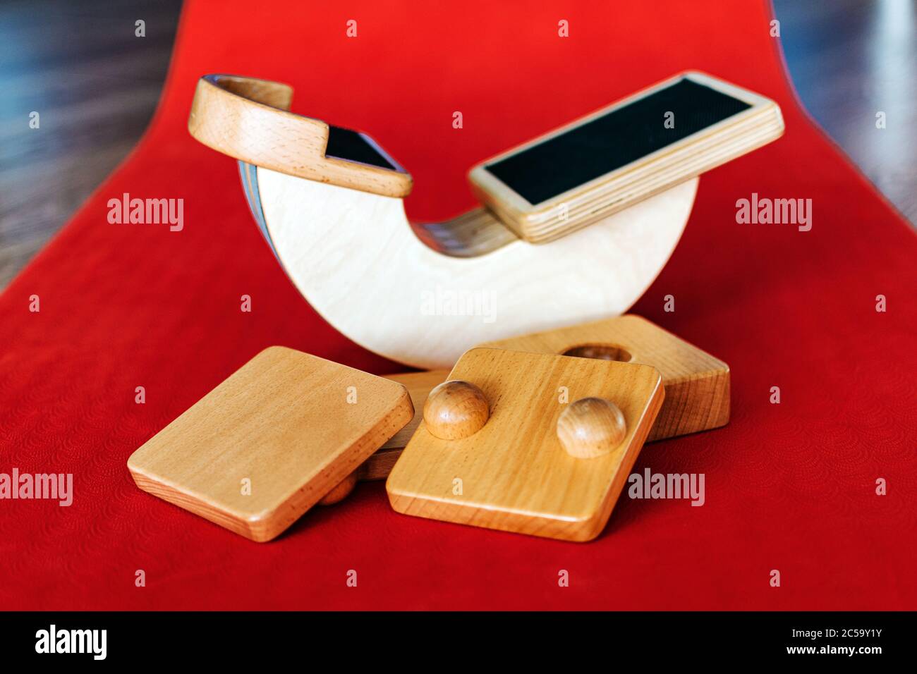 Balance simulator set on a red background Stock Photo - Alamy