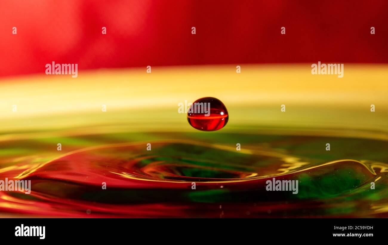 Red water droplet. Splash photography of colored water drips. Food ...