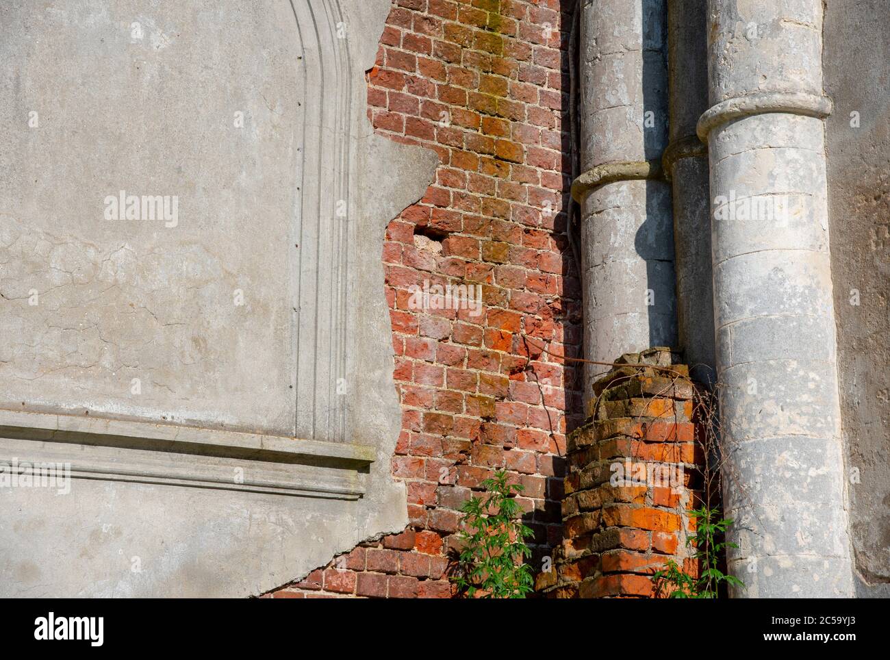 A fragment of a brick wall with paint peeling off Stock Photo - Alamy