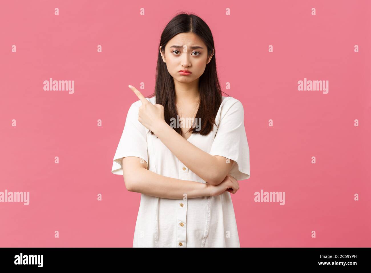 Beauty, people emotions and summer leisure concept. Upset gloomy girl in white dress, sulking ...
