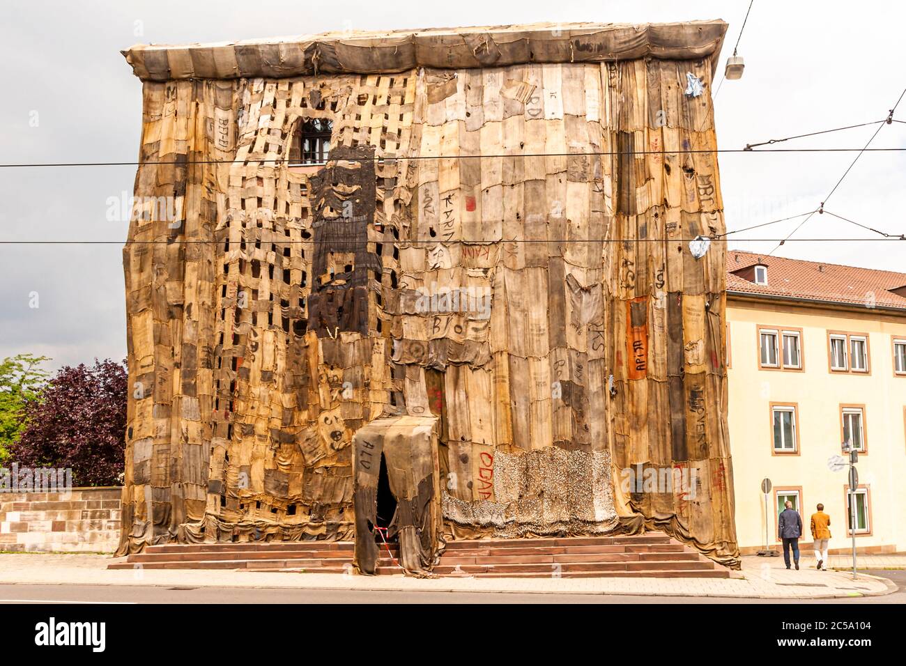 The wrapping of the gate guards with jute sacks by Ibrahim Mahama from ...