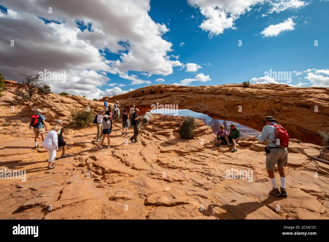 Visitors creating photographic memories at the iconic Mesa Arch in ...