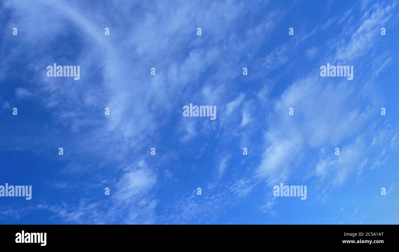 Low angle view of a blue cloudy sky at daytime - perfect for wallpapers ...