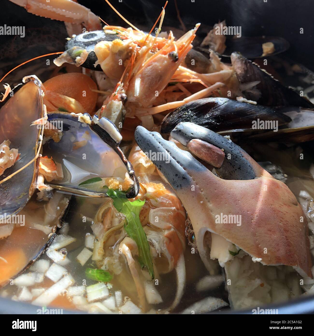 Fish stock in shrimp shells crab claws Norway lobster marinated in soup ...