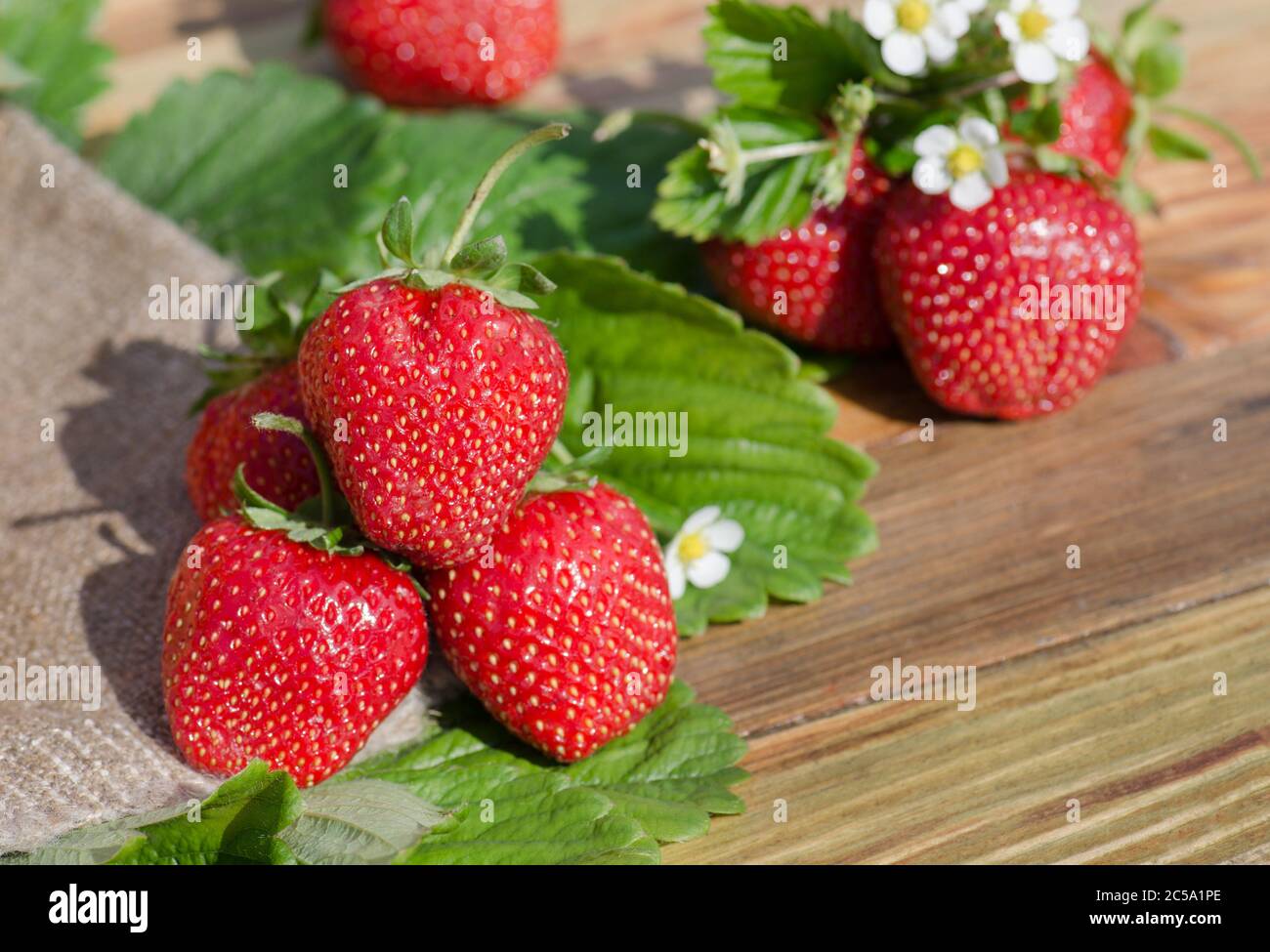 Strawberries on wooden table. Heap of fresh strawberries. Natural ...