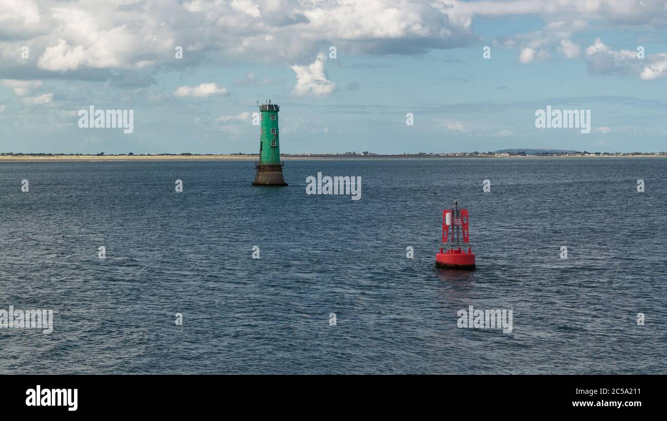 Green and red buoy tower lighthouse at Dublin harbour Stock Photo - Alamy