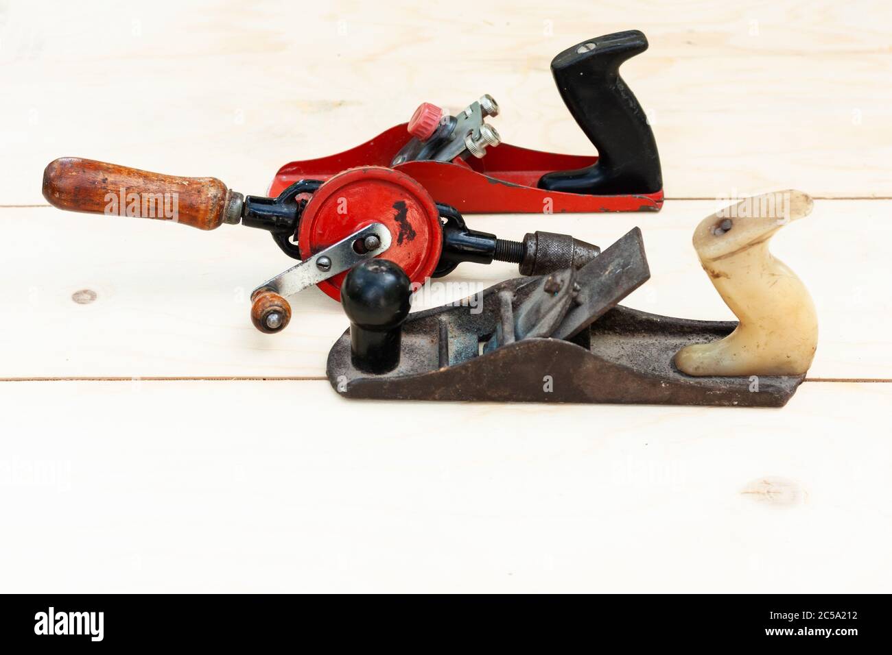 Joinery – old wooden plane, wood polishing tool in a workshop of the ...