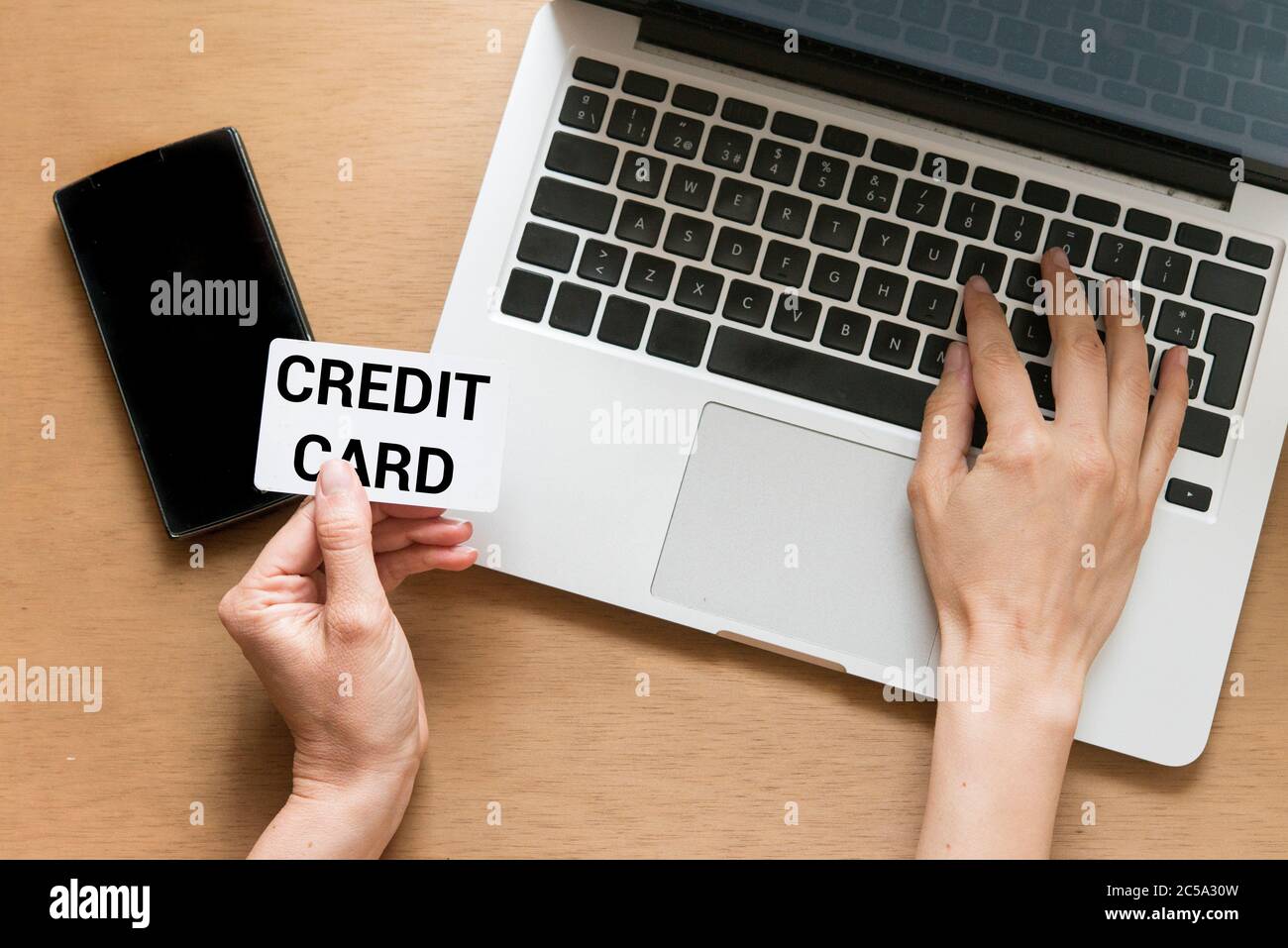 Top view of man using credit card for online shoping Stock Photo - Alamy