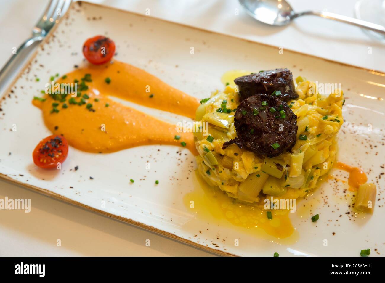 Traditional Catalan tapas - omelet with sauteed beans, morcilla and ...