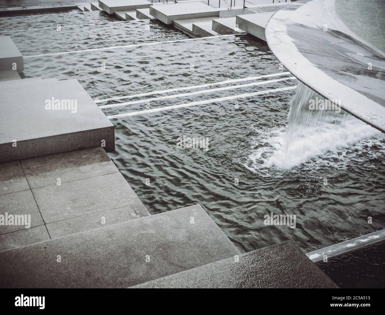 Closeup photo of a fountain in the form of a stream of water flowing ...