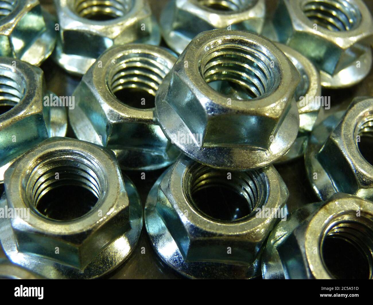 High angle shot of metal nuts bunch Stock Photo - Alamy