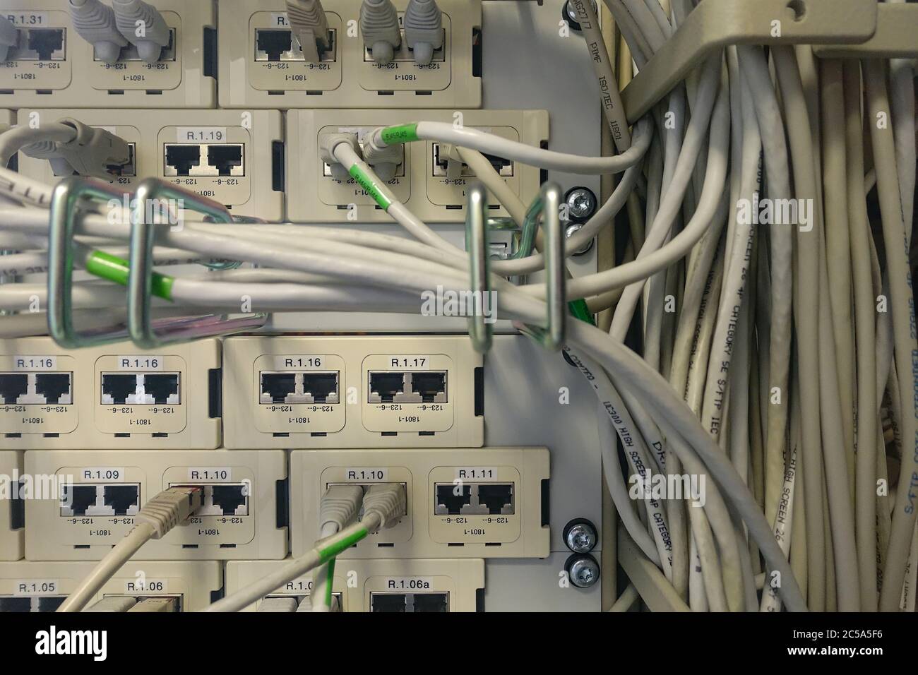 Closeup shot of many complicated electronic wires on the white wall ...