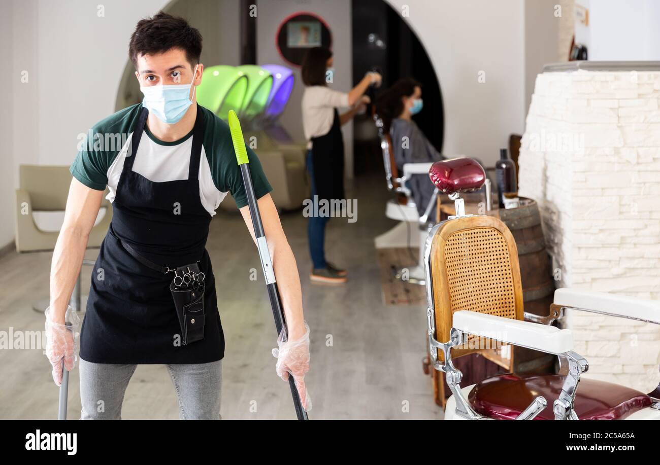 Barber cleaning floor hairdresser salon hi-res stock photography and ...