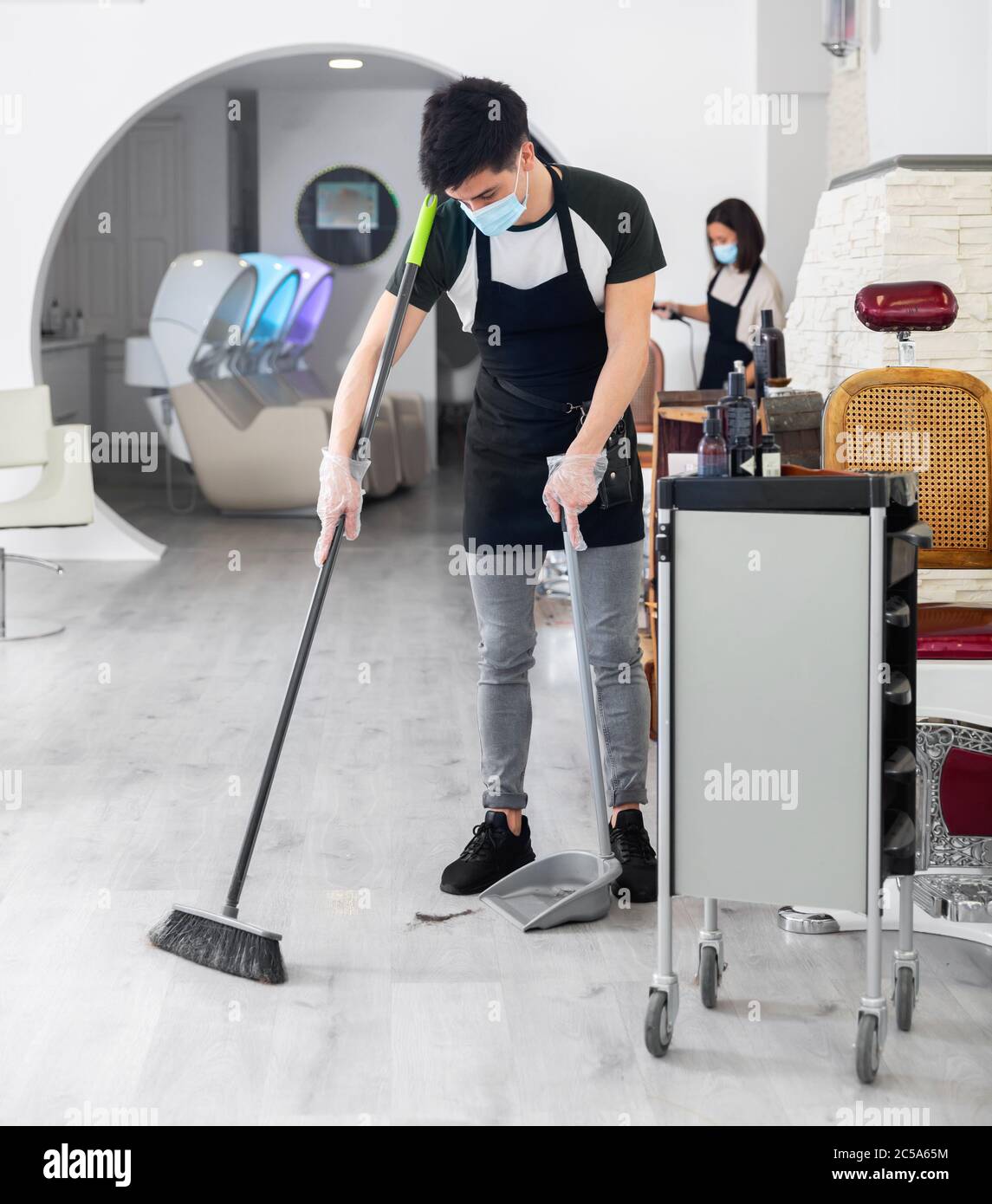 Barber cleaning floor hairdresser salon hi-res stock photography and ...