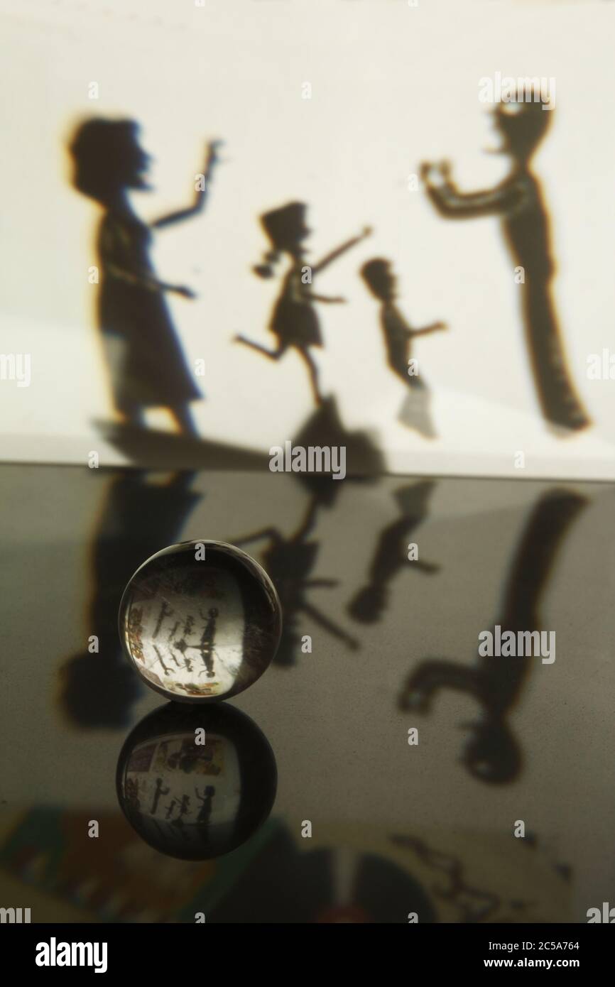 Closeup shot of a reflective crystal ball on a glass surface with a ...