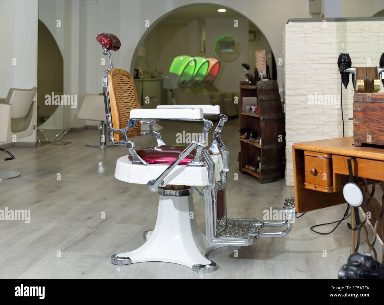 Interior of modern light beauty salon, empty space with chairs and hair ...