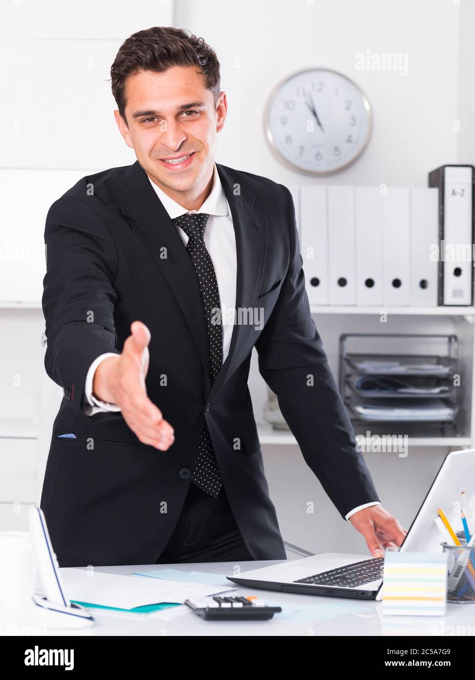 Businessman stretching open hand offering handshake and inviting to ...