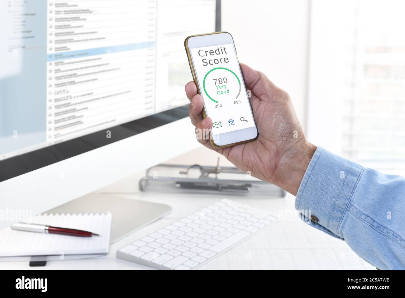Credit Score Concept. Closeup of a man checking his score on his cell ...