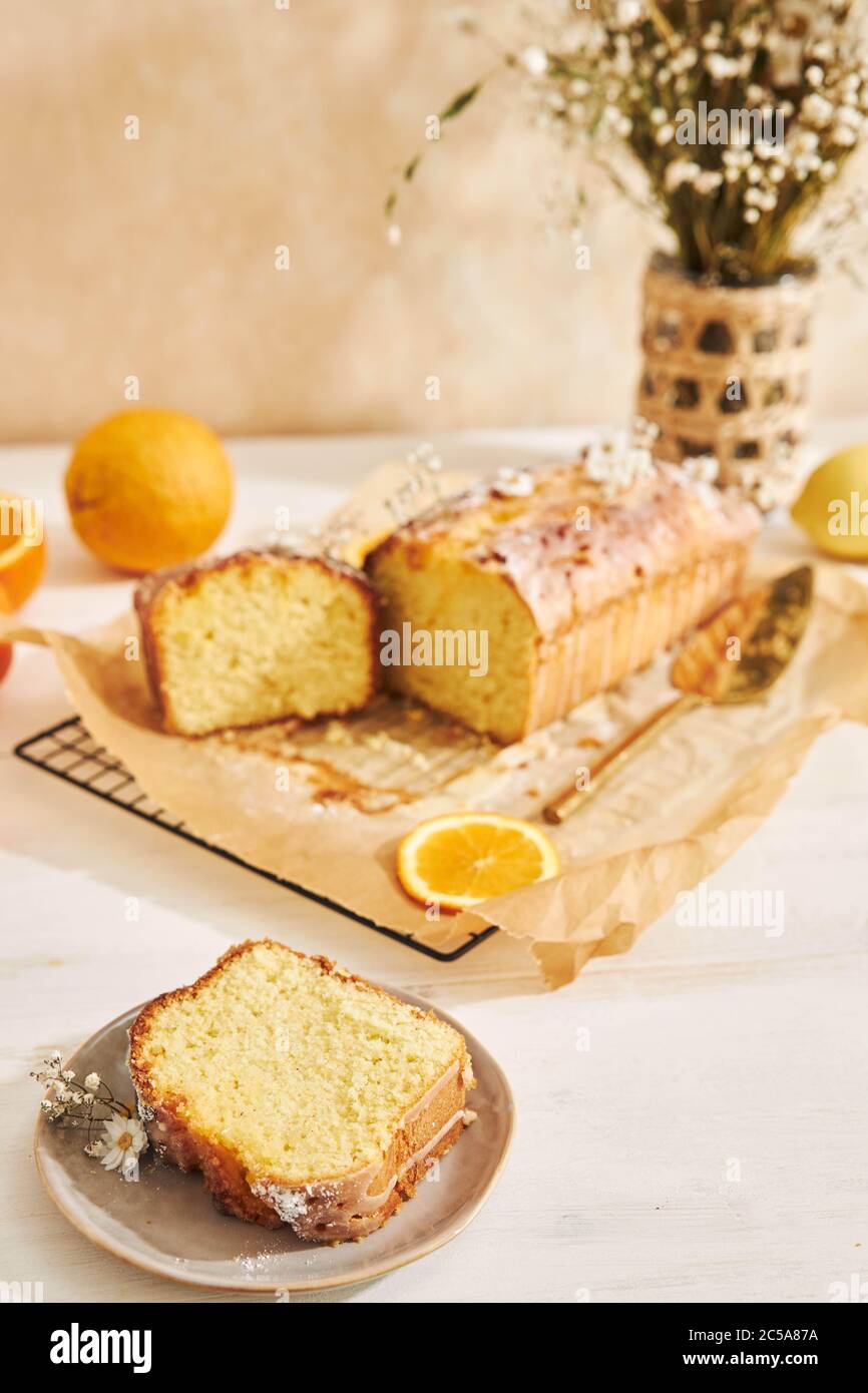 Vertical closeup shot of a piece of delicious summer orange cake with ...