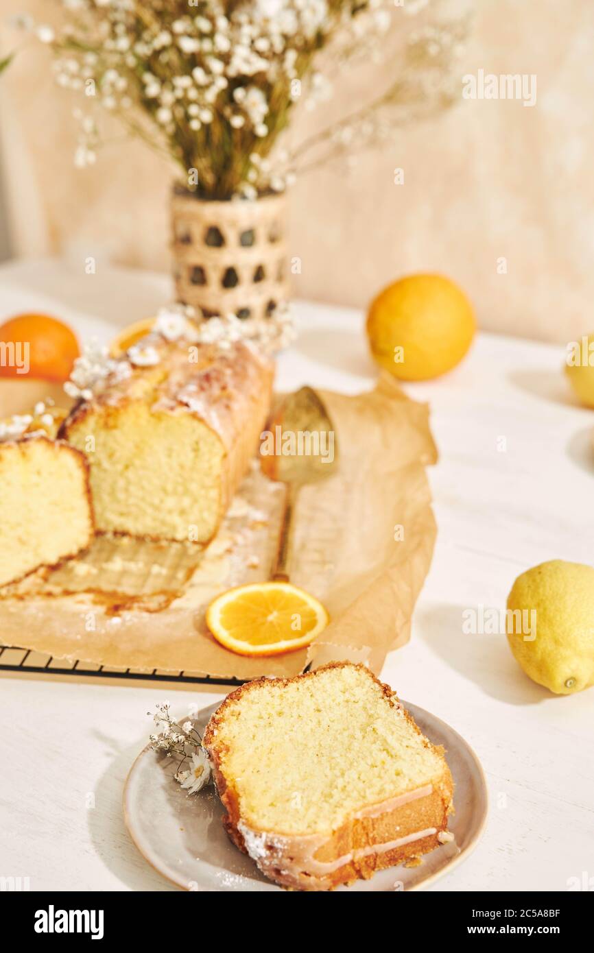 Vertical closeup shot of a piece of delicious summer orange cake with ...