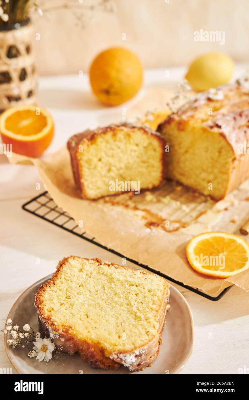Vertical closeup shot of a piece of delicious summer orange cake with ...