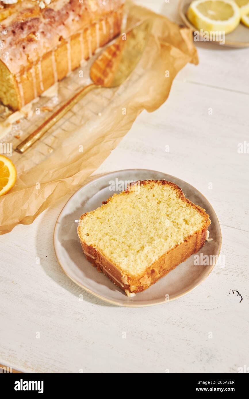 Vertical closeup shot of a piece of delicious summer orange cake with ...