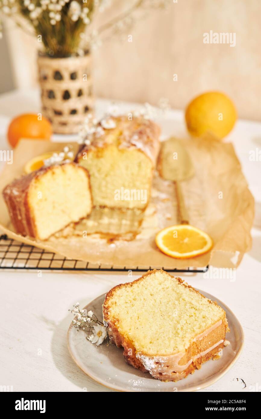 Vertical closeup shot of a piece of delicious summer orange cake with ...