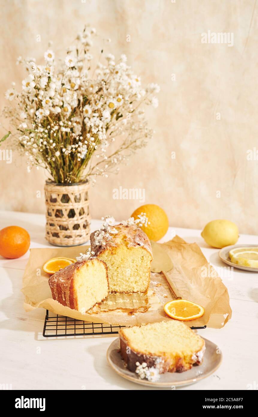Vertical closeup shot of a piece of delicious summer orange cake with ...