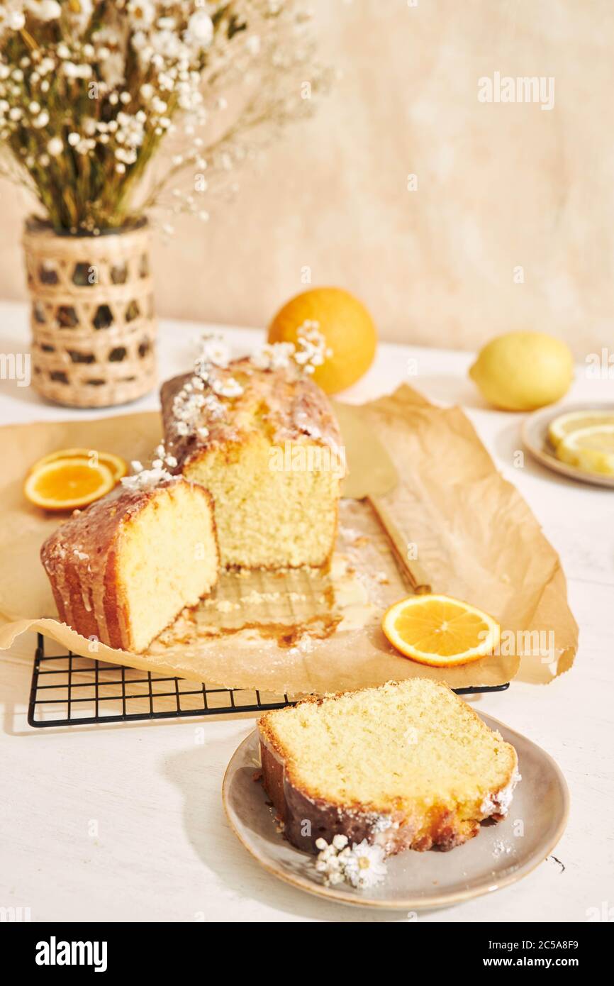 Vertical closeup shot of a piece of delicious summer orange cake with ...