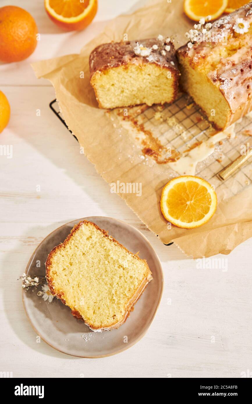 Vertical closeup shot of a piece of delicious summer orange cake with ...