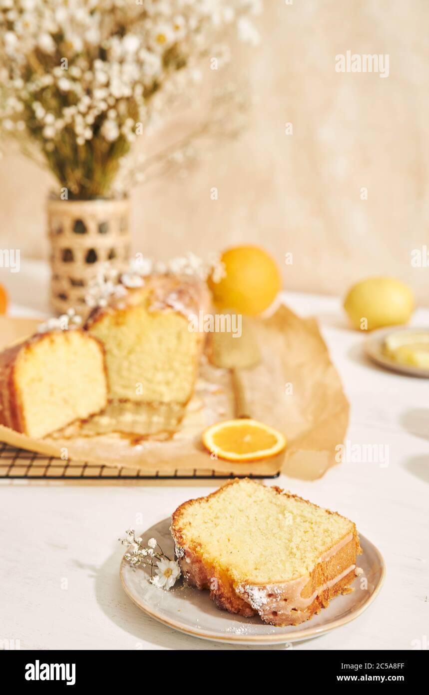 Vertical closeup shot of a piece of delicious summer orange cake with ...