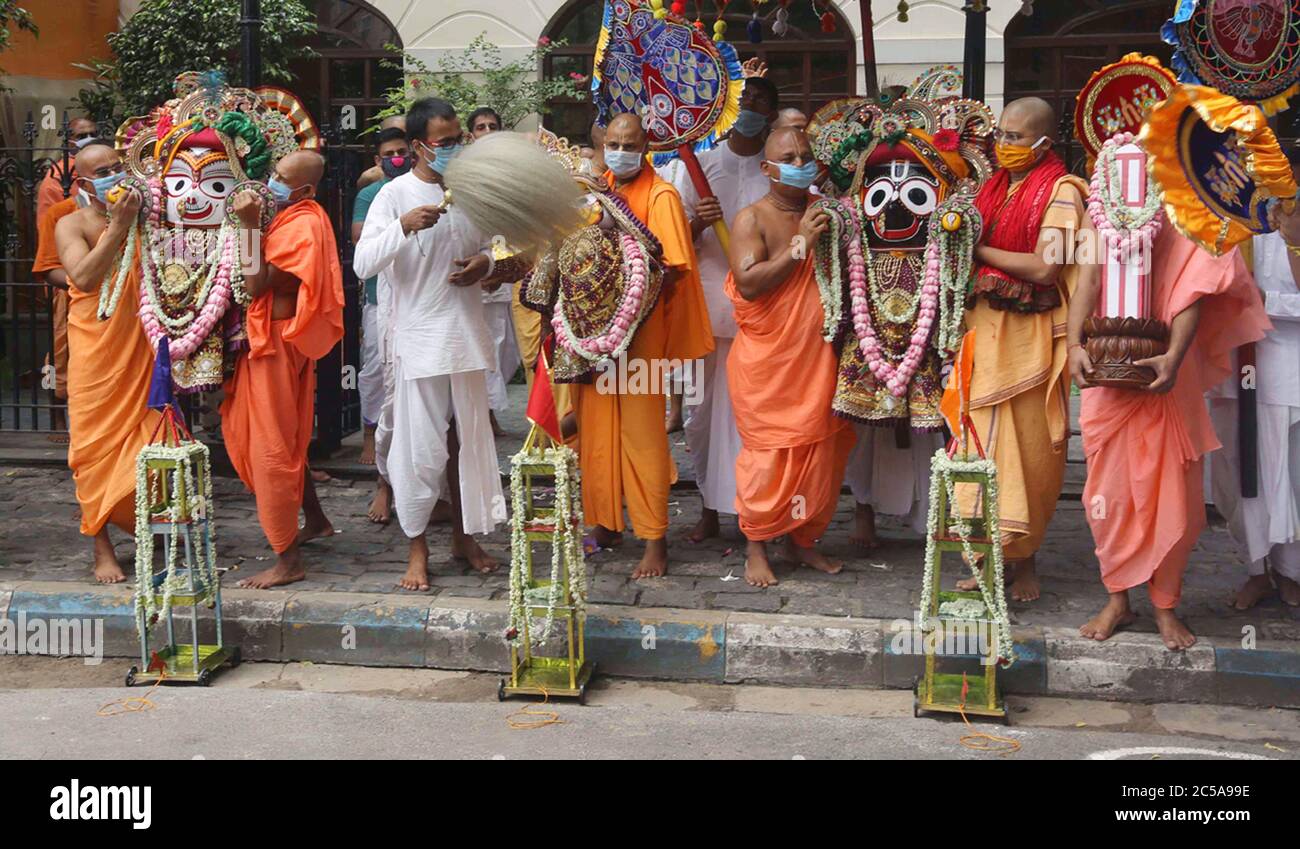 Kolkata, India. 01st July, 2020. Priest of ISKCON hold idols of Lord ...